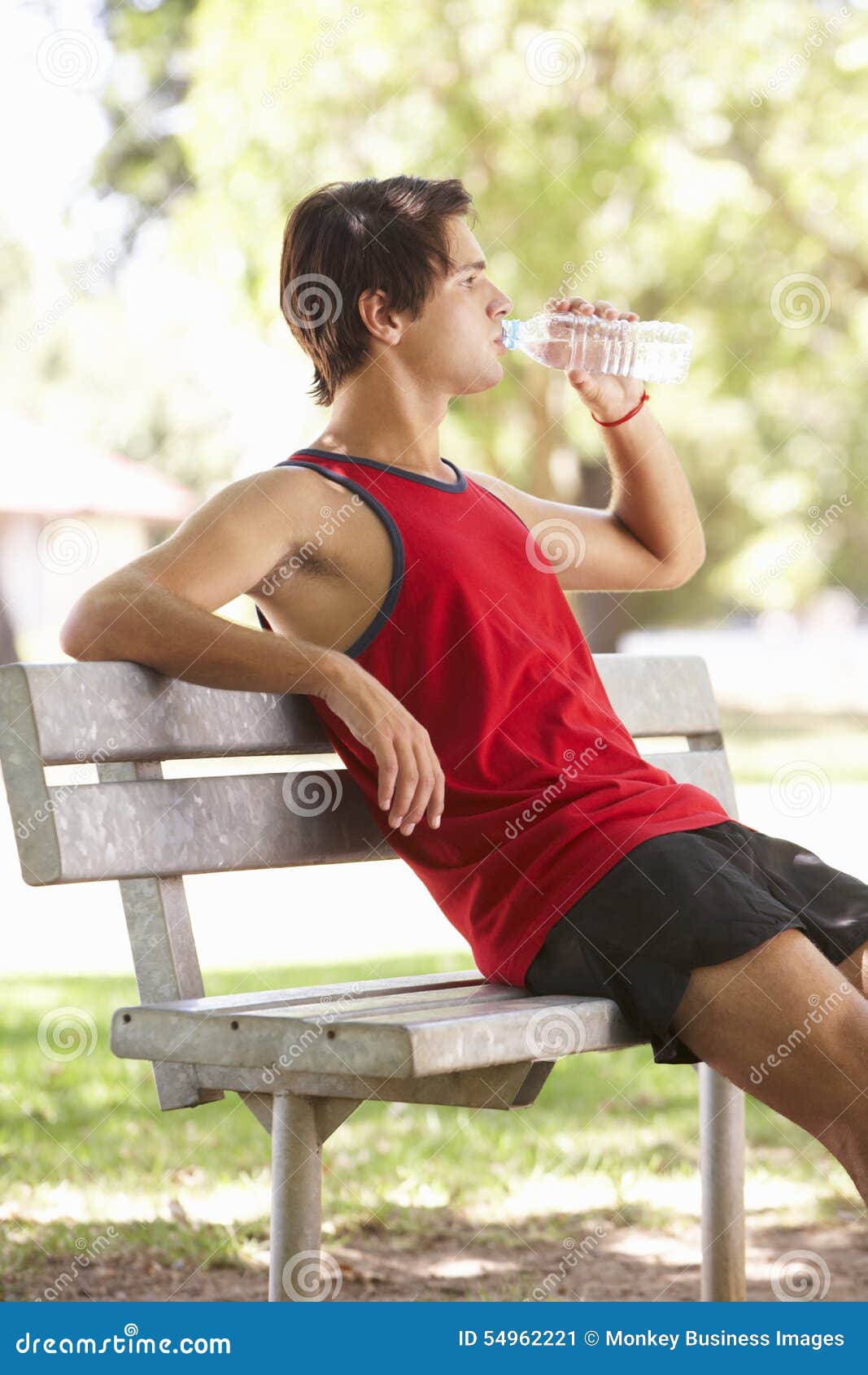 Young Man Resting after Exercise in Park Stock Image - Image of ...