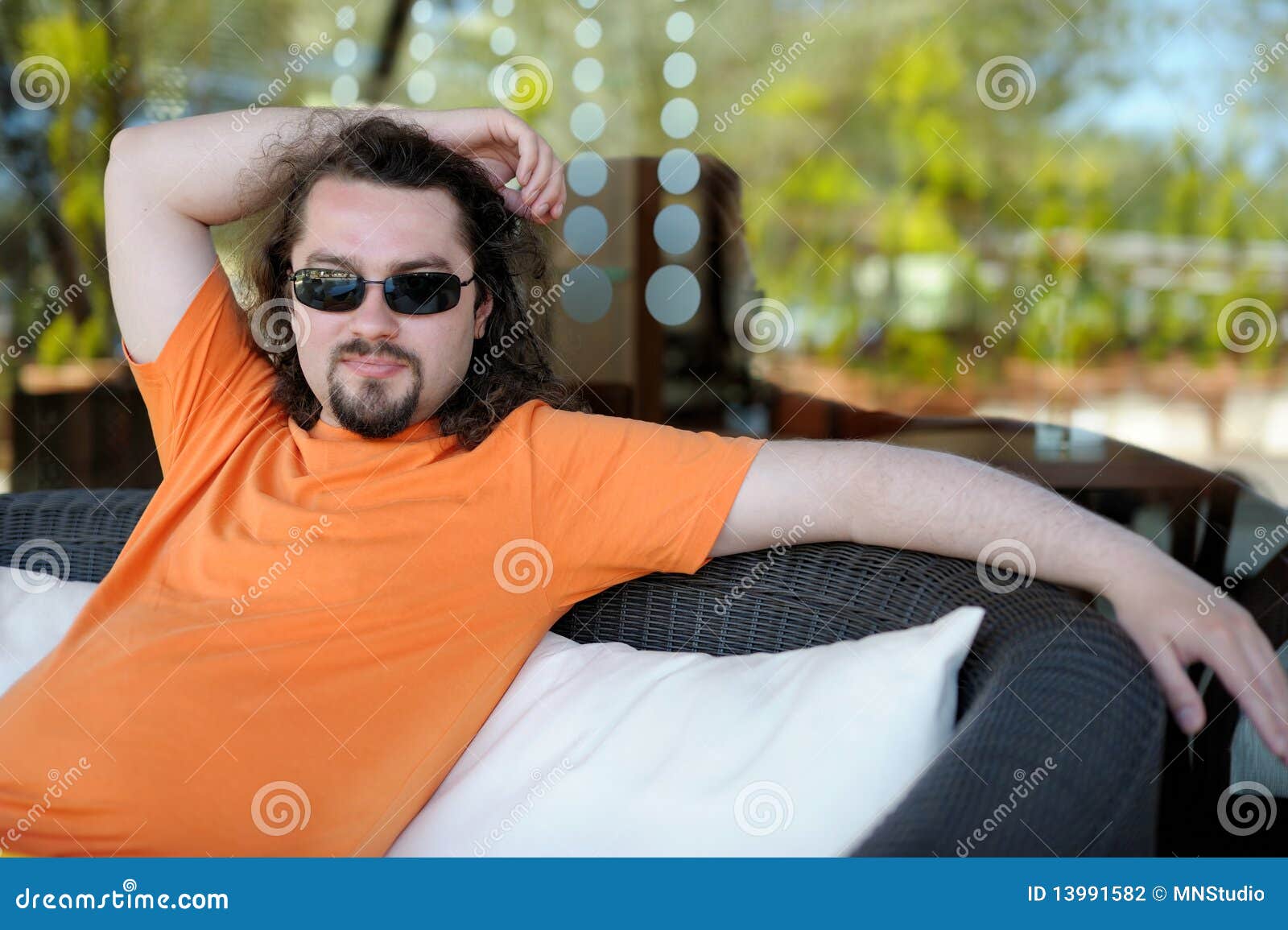 Young Man Resting at a Resort Stock Photo - Image of sunny, tropical ...