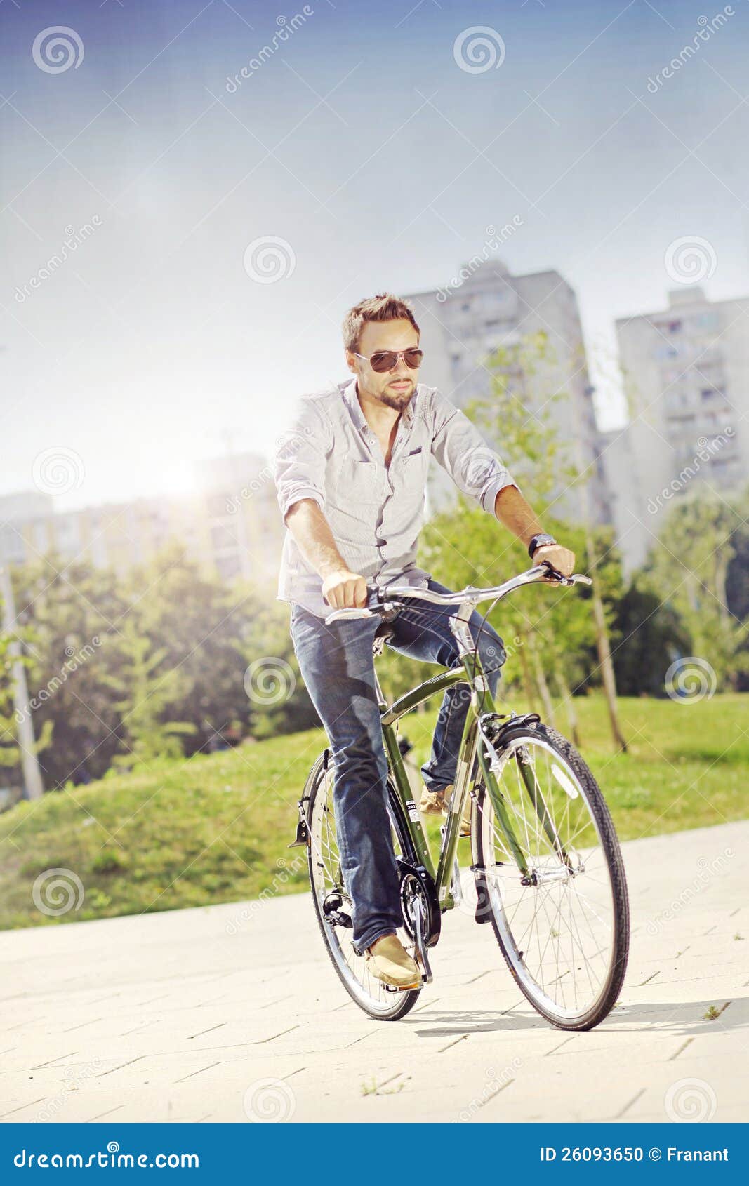 Young man riding bicycle stock photo. Image of orange - 26093650