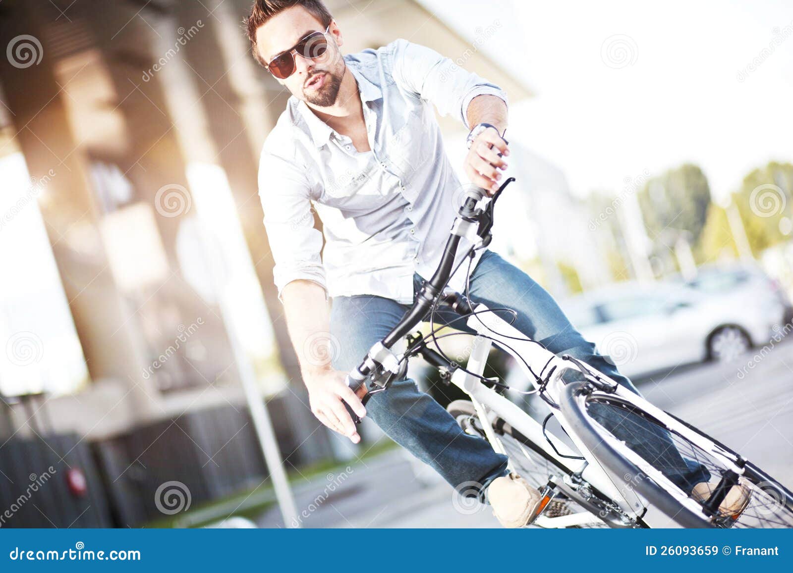 Young man riding a bicycle stock image. Image of adult - 26093659