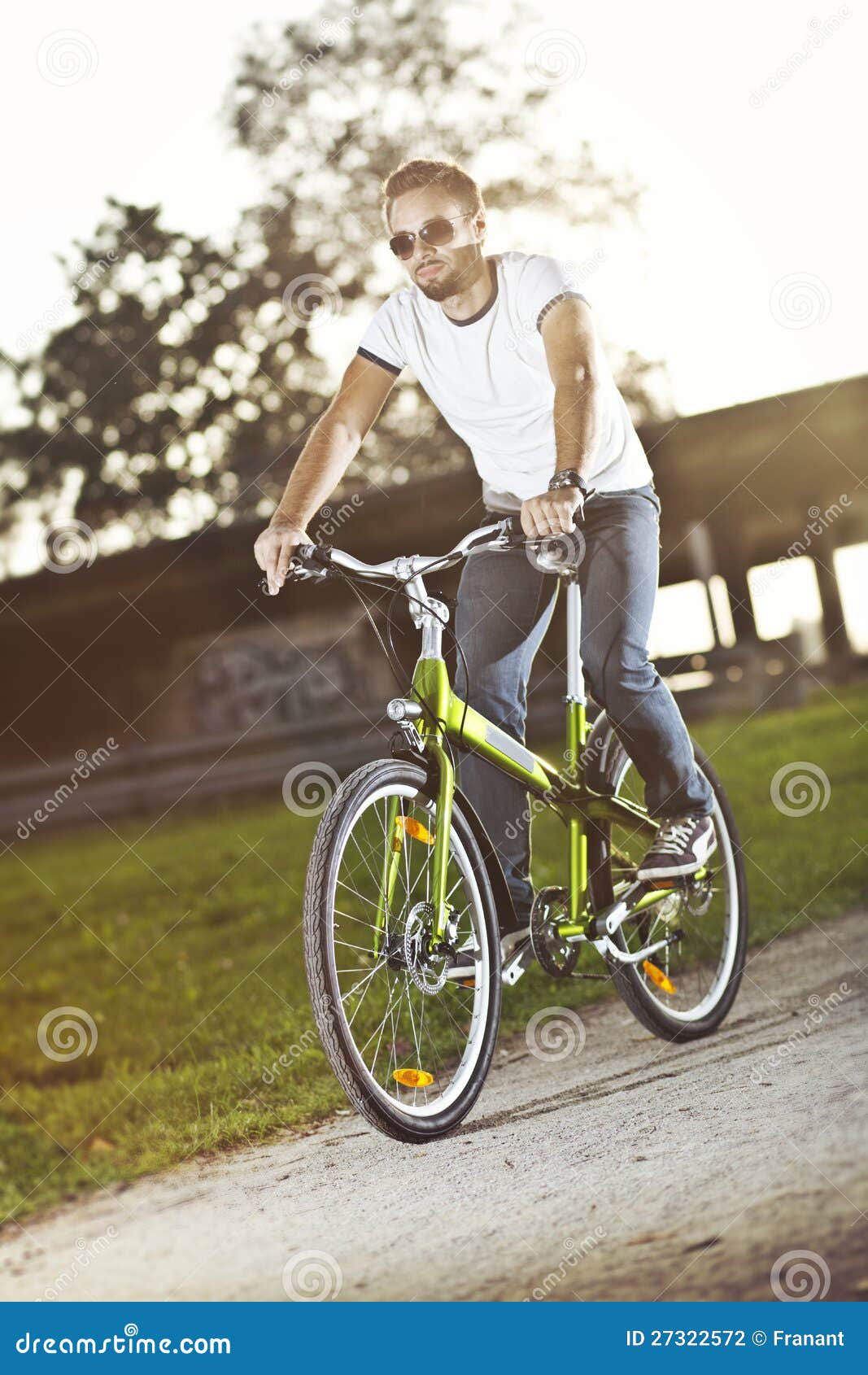 Young man riding bicycle stock photo. Image of concept - 27322572