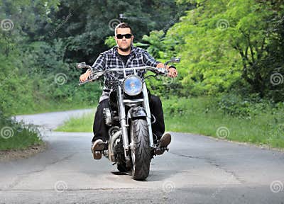 Young Man Riding a Chopper on a Road Stock Photo - Image of forest ...