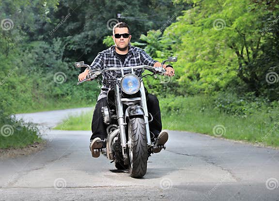 Young Man Riding a Chopper on a Road Stock Photo - Image of forest ...