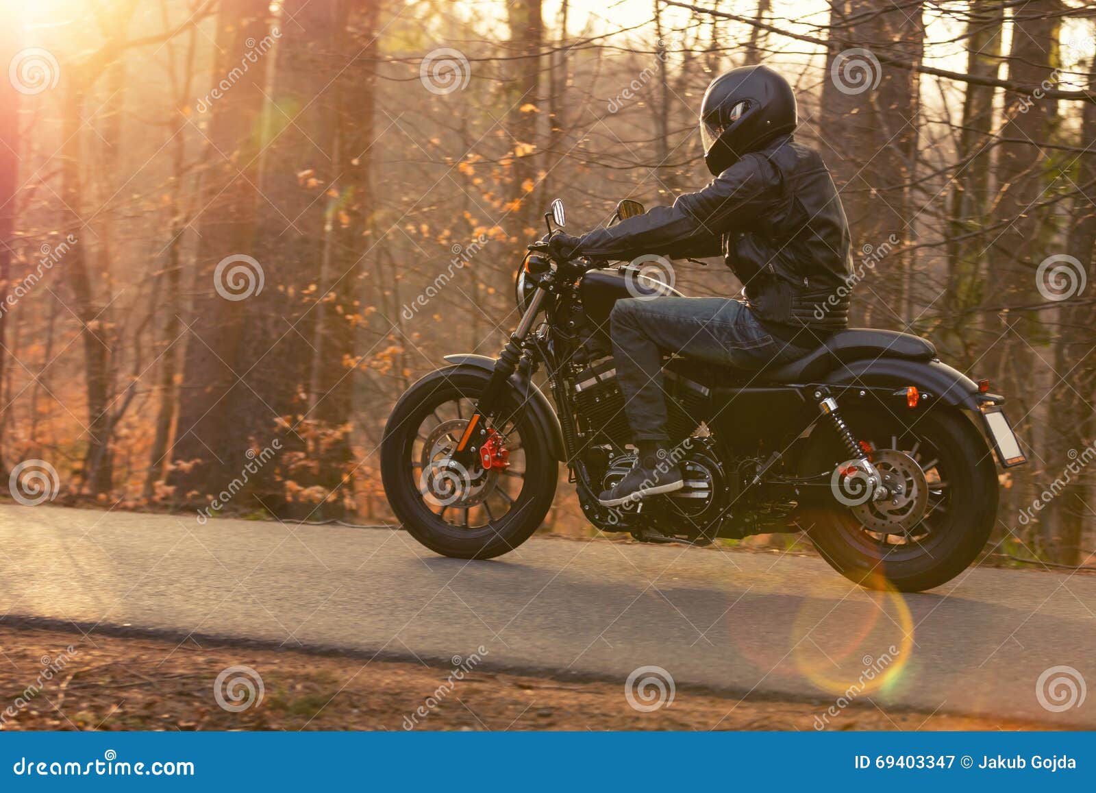 Young Man Riding Chopper on Road in Forest Stock Image - Image of ...