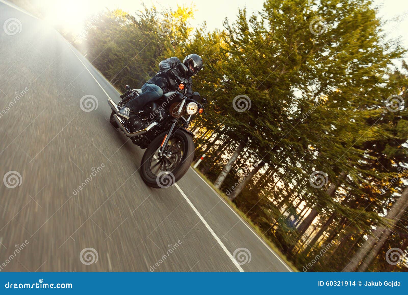 A Young Man Riding a Chopper on a Road Stock Photo - Image of bike ...