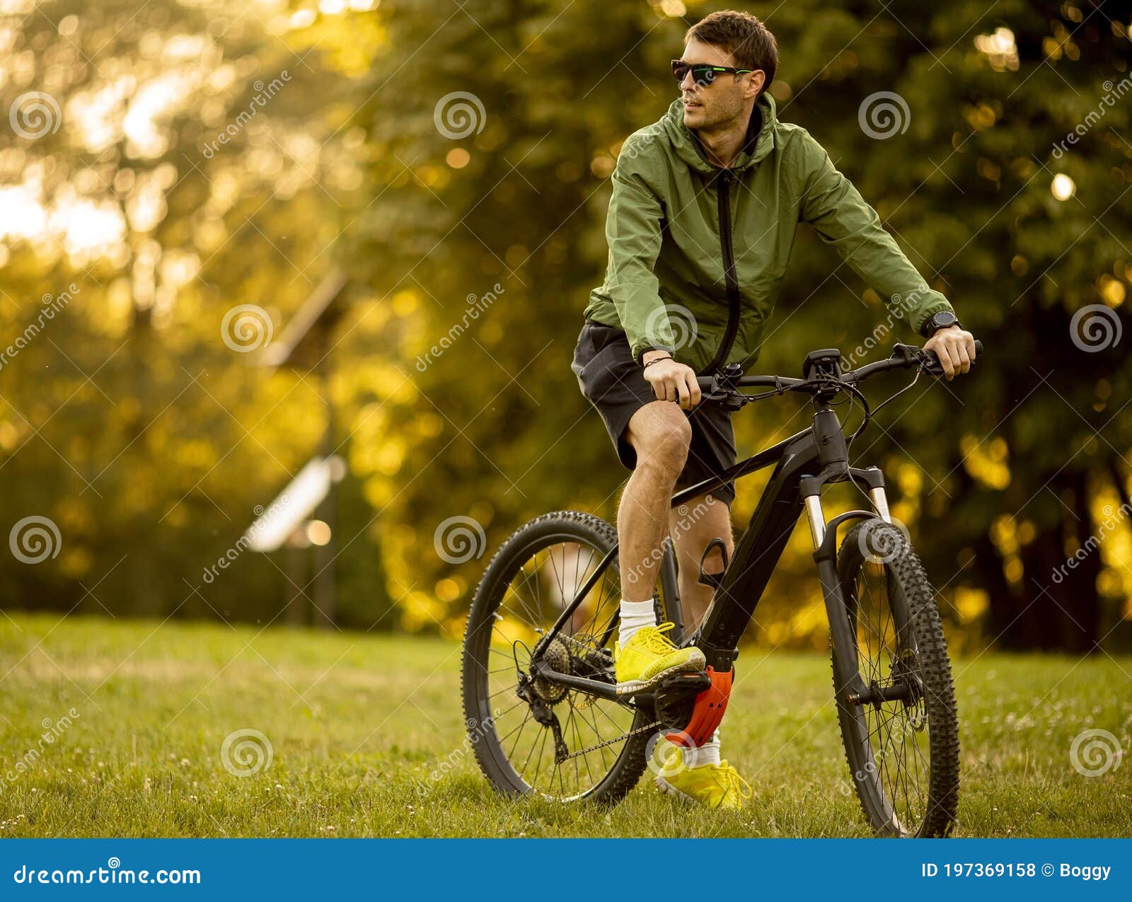 Young Man Riding Ebike in the Park Stock Photo - Image of cycle ...