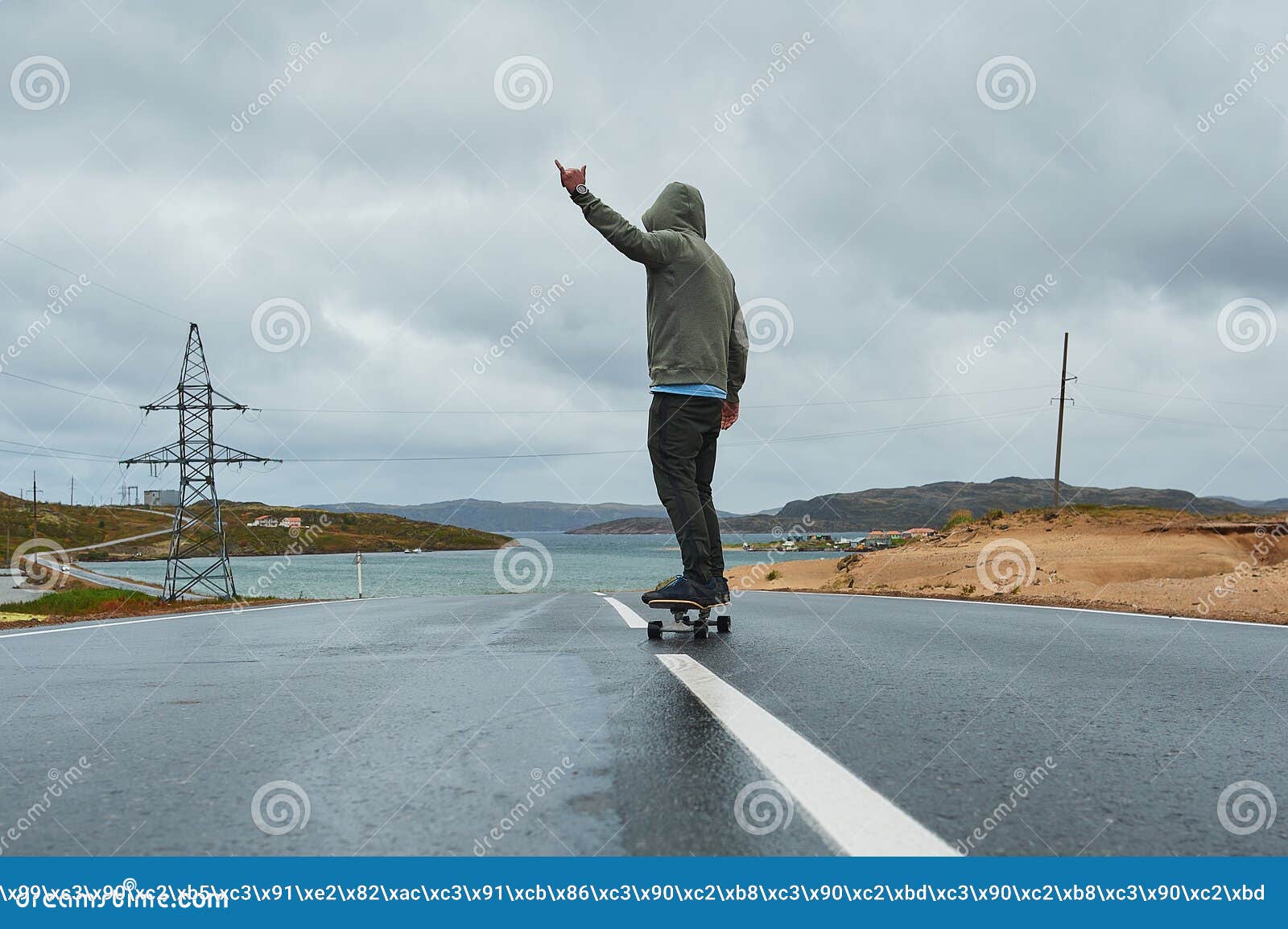 Young Man Riding a Longboard on Empty Winding Mountain Road in Summer ...