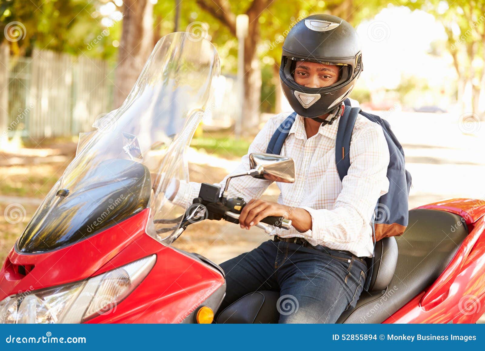 Young Man Riding Motor Scooter To Work Stock Photo - Image of urban ...