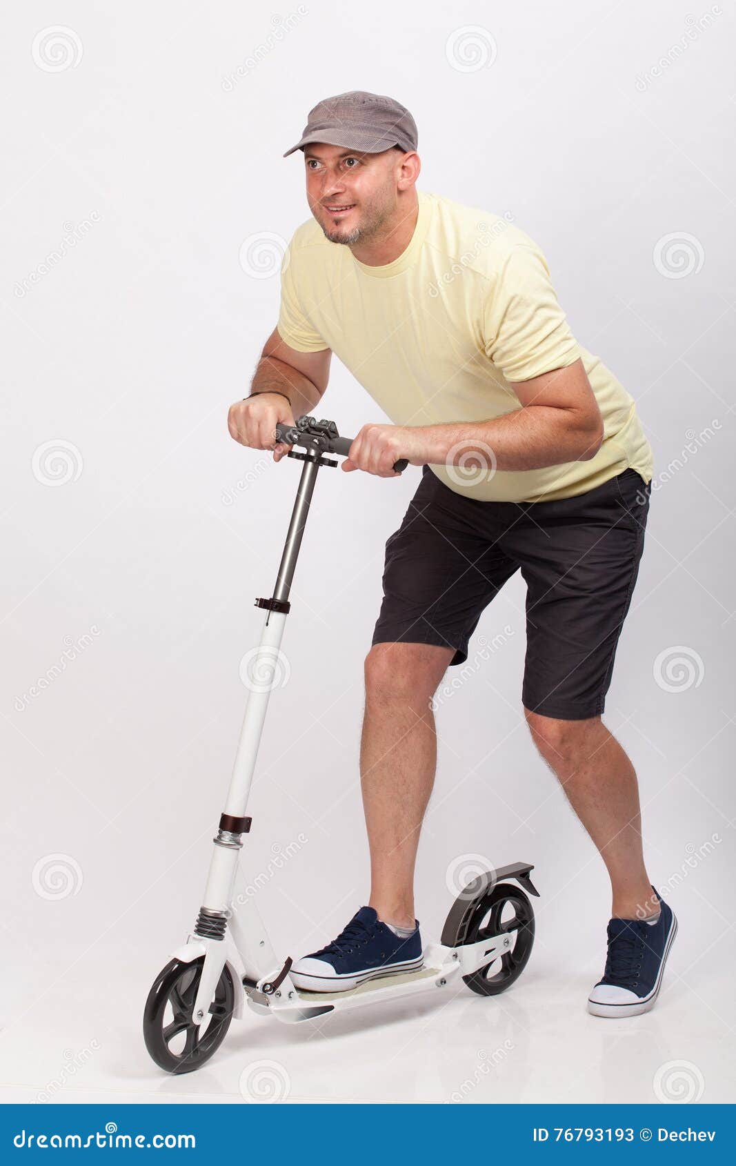 Young Man Riding a Push Scooter in Studio Stock Image - Image of ...
