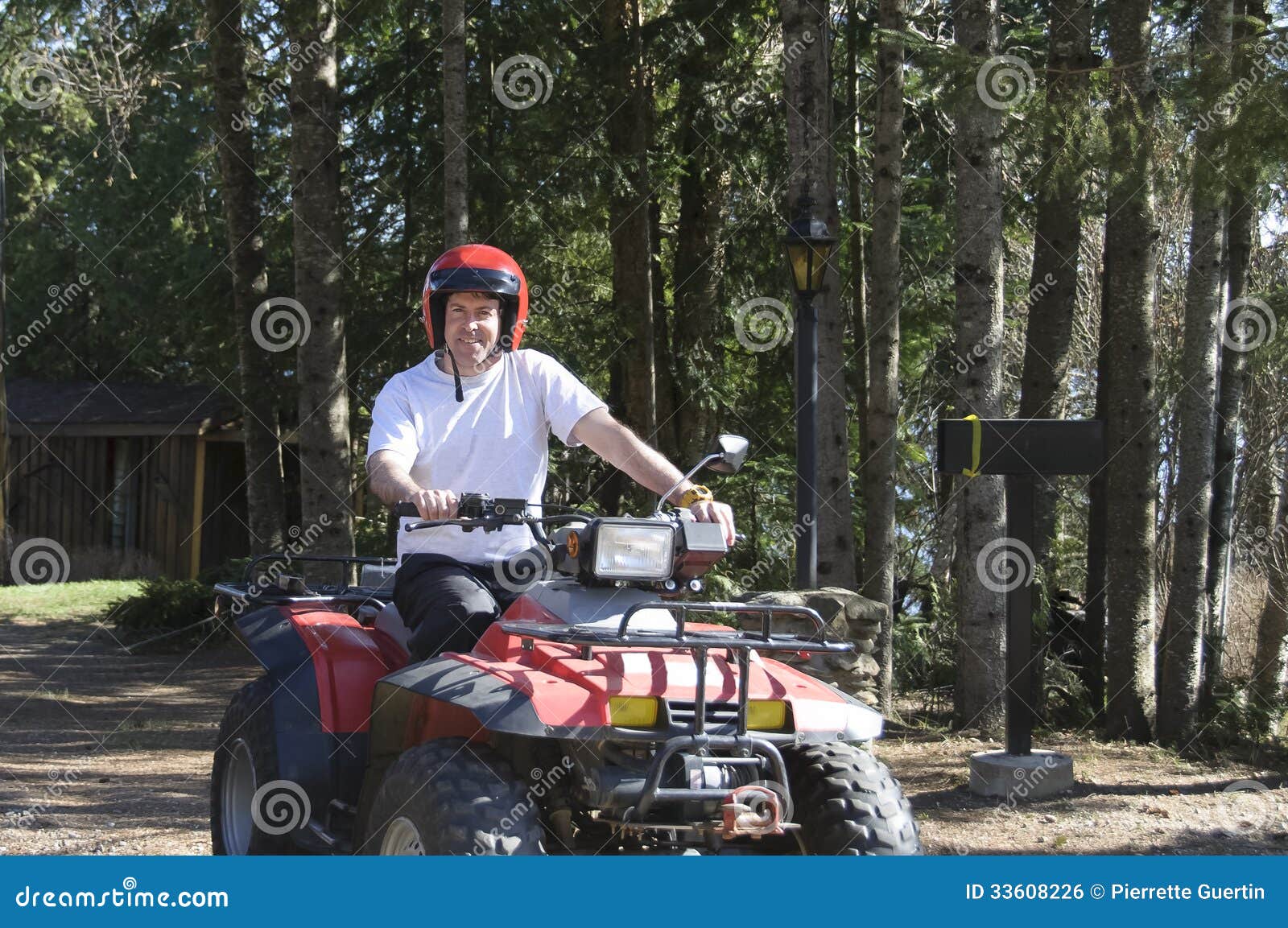 Young man riding a Quad stock photo. Image of riders - 33608226