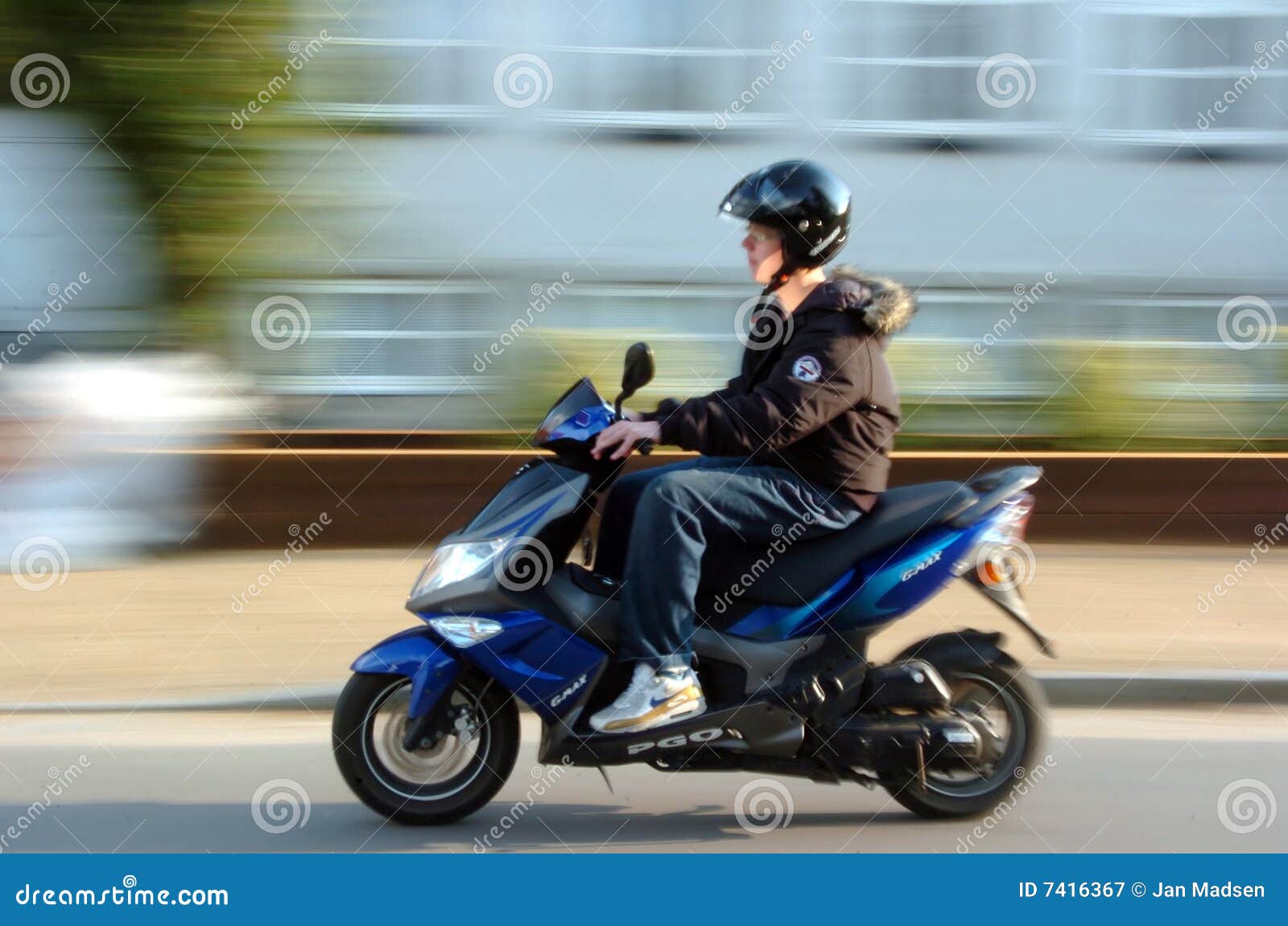 Young man riding scooter stock image. Image of motorcycle - 7416367