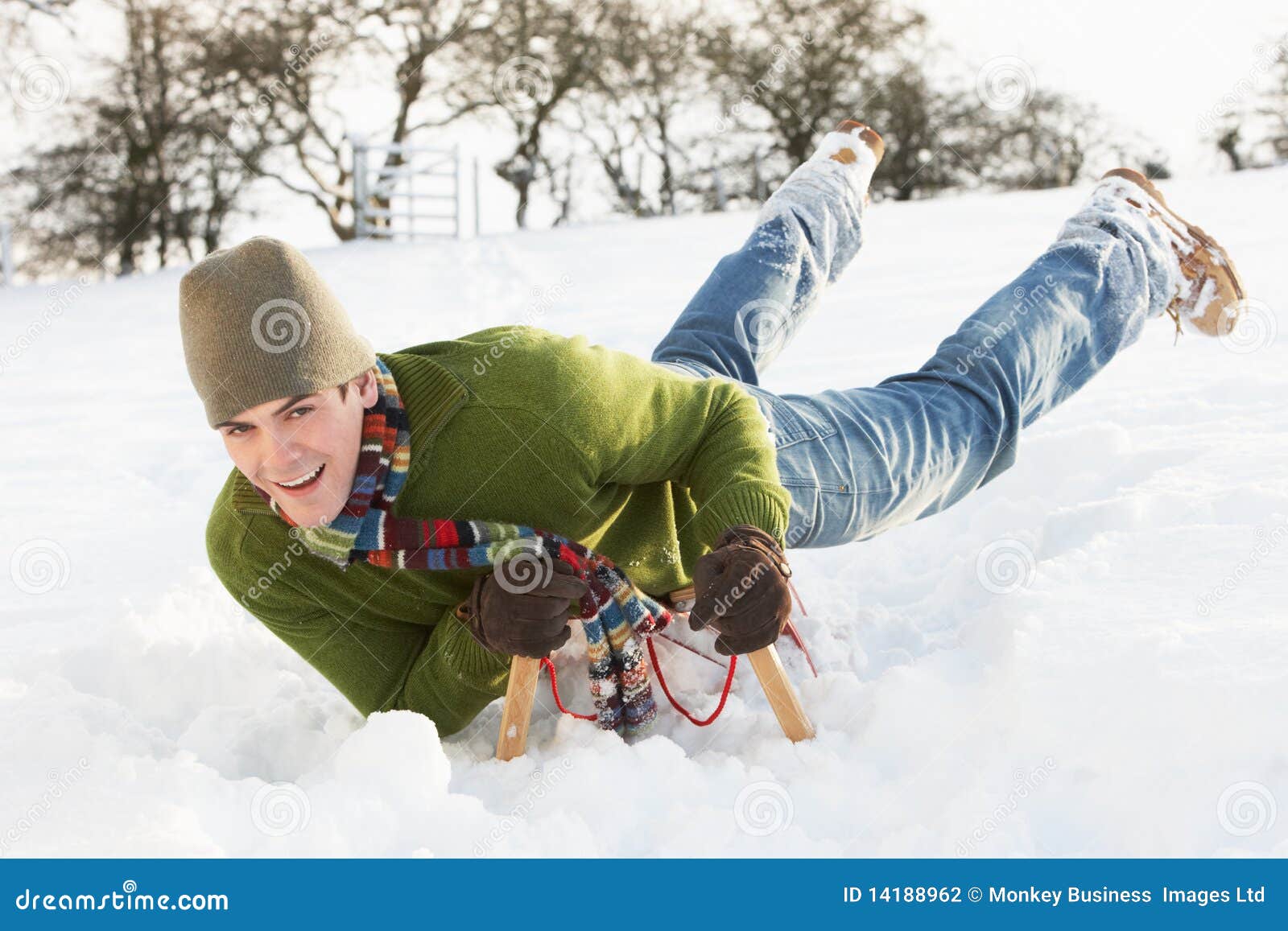 Young Man Riding on Sledge in Snowy Landscape Stock Photo - Image of ...
