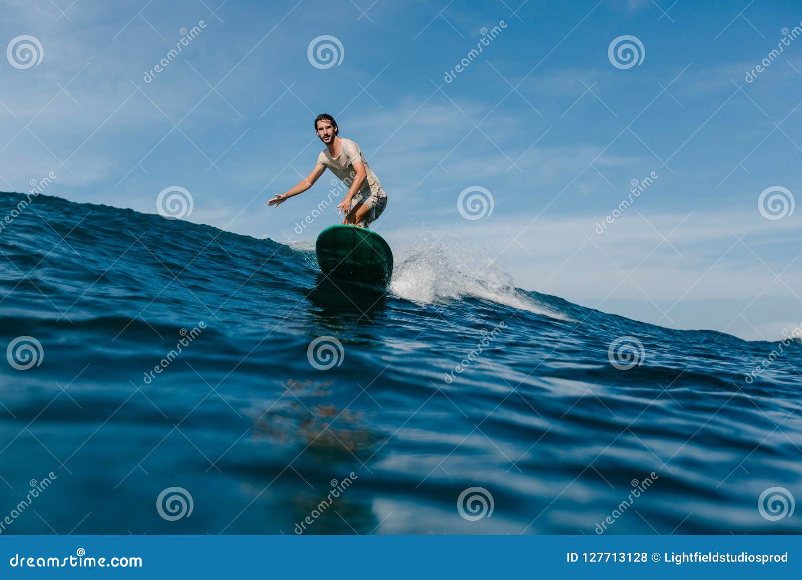 Young Man Riding Waves on Surfboard Stock Photo - Image of seascape ...