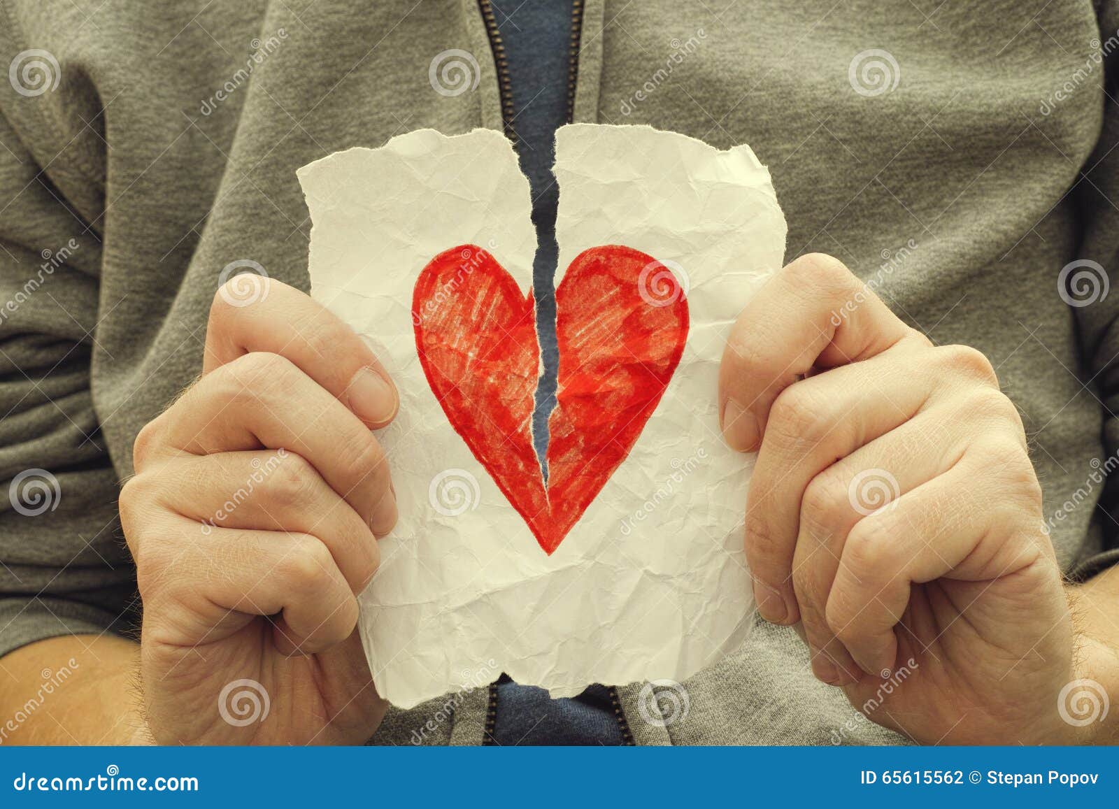 Young Man Ripping Red Heart on a Piece of Paper Stock Photo - Image of ...