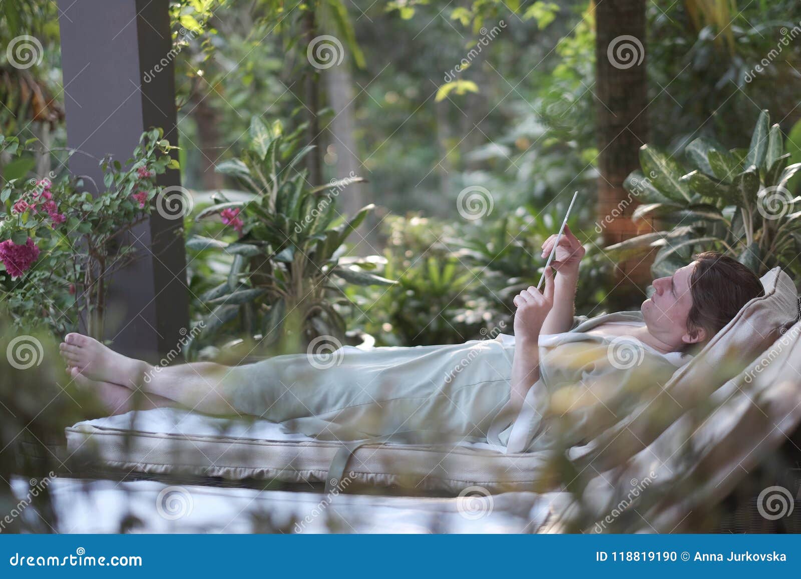 A Young Man in a Robe Lies on a Sofa Stock Photo - Image of leisure ...