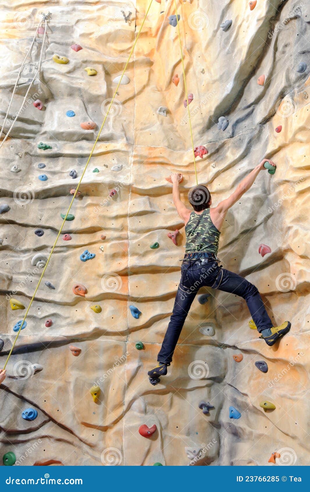 Young man on rock wall stock image. Image of indoor, climbing - 23766285