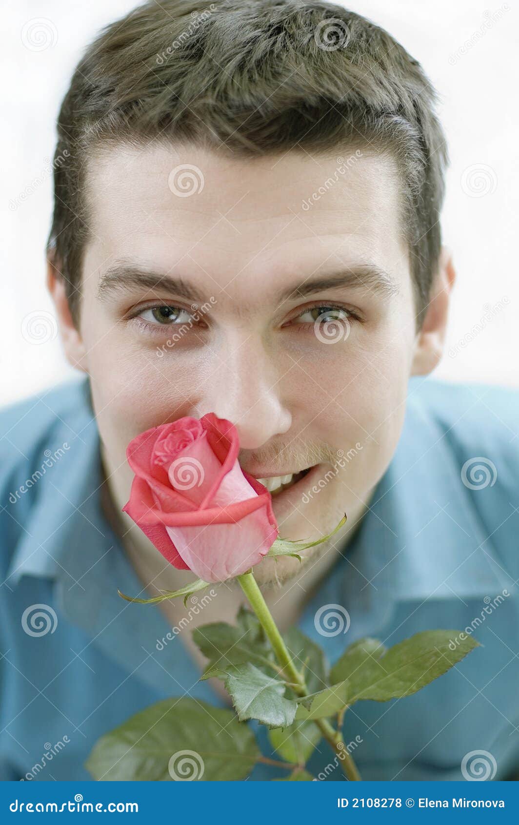 Young man with a rose stock photo. Image of flower, close - 2108278