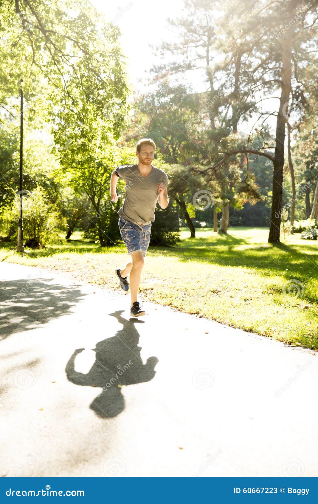 Young Man Running in the Autumn Park Stock Image - Image of exercise ...