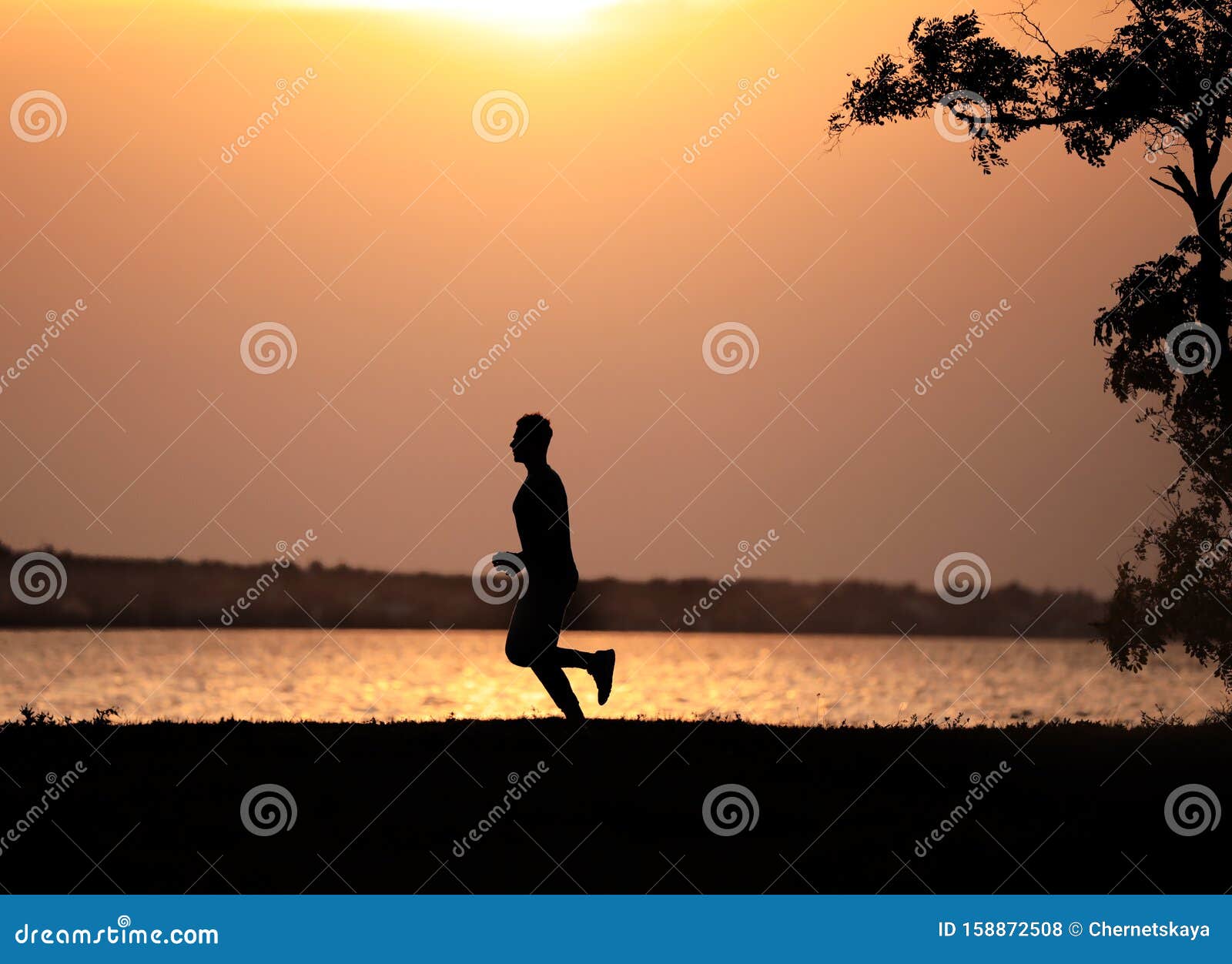 Young Man Running Near River Stock Photo - Image of evening, healthy ...