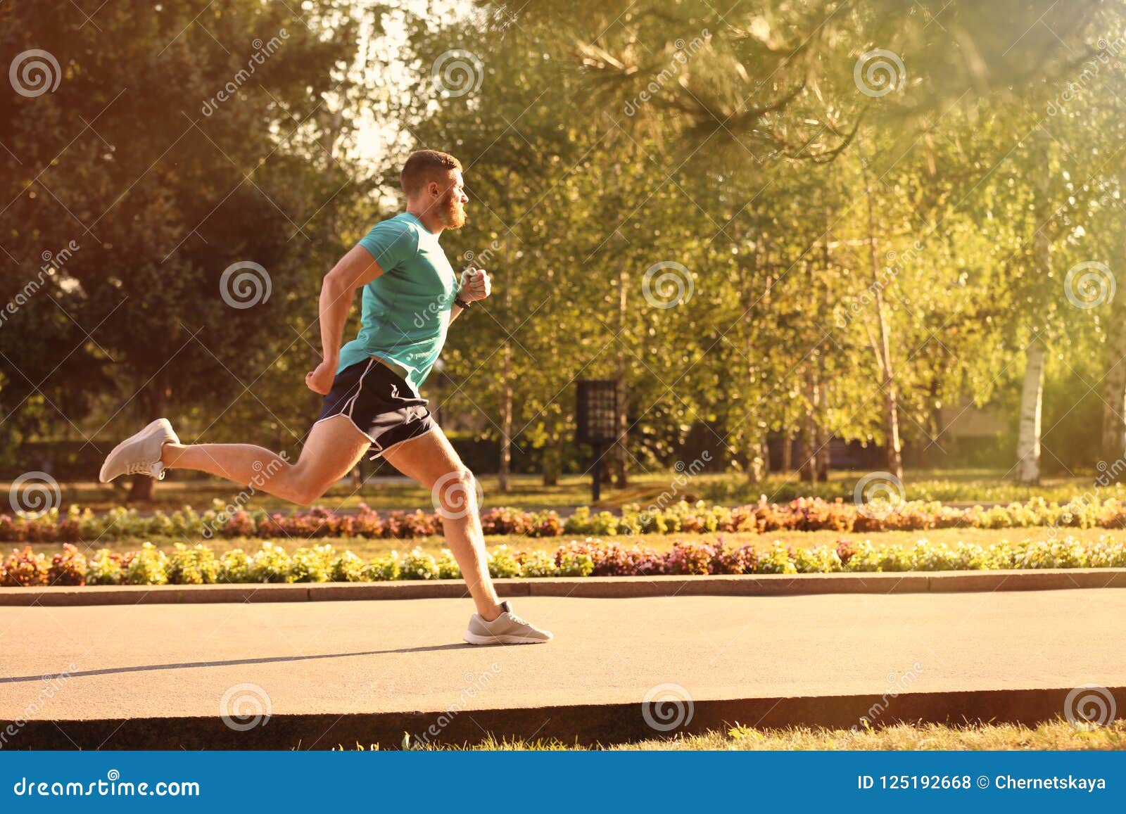 Young man running in park stock photo. Image of athletic - 125192668