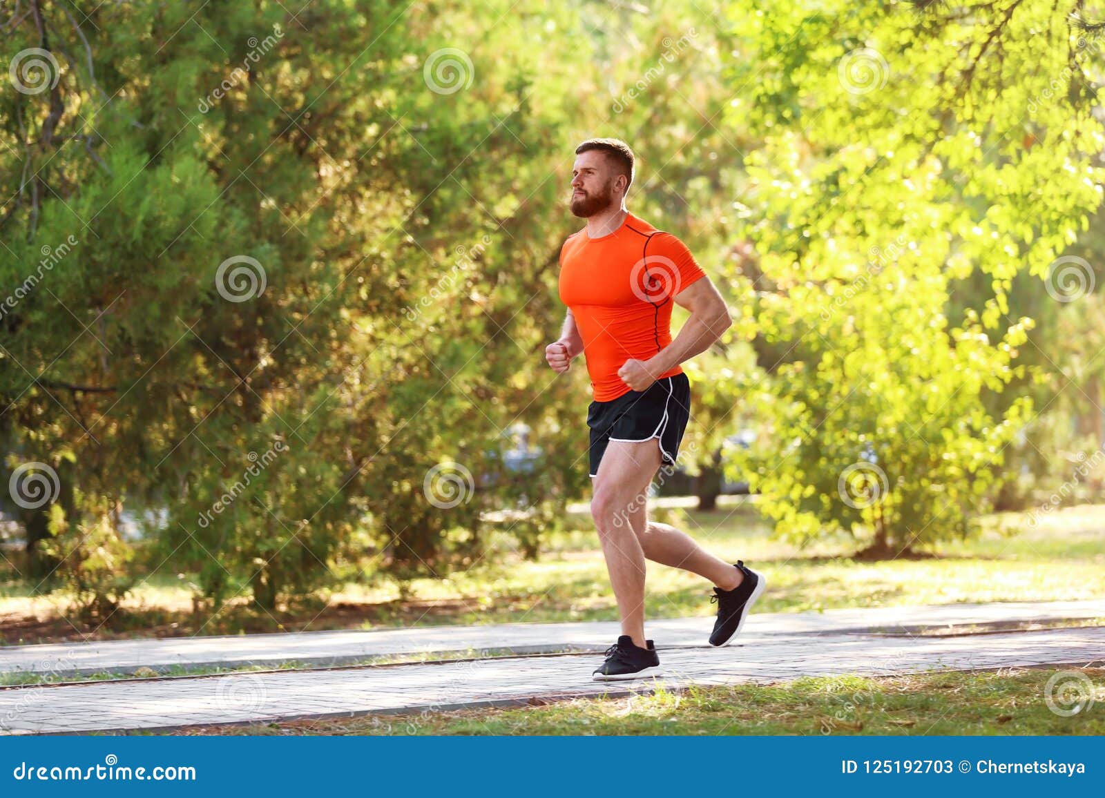 Young man running in park stock image. Image of park - 125192703