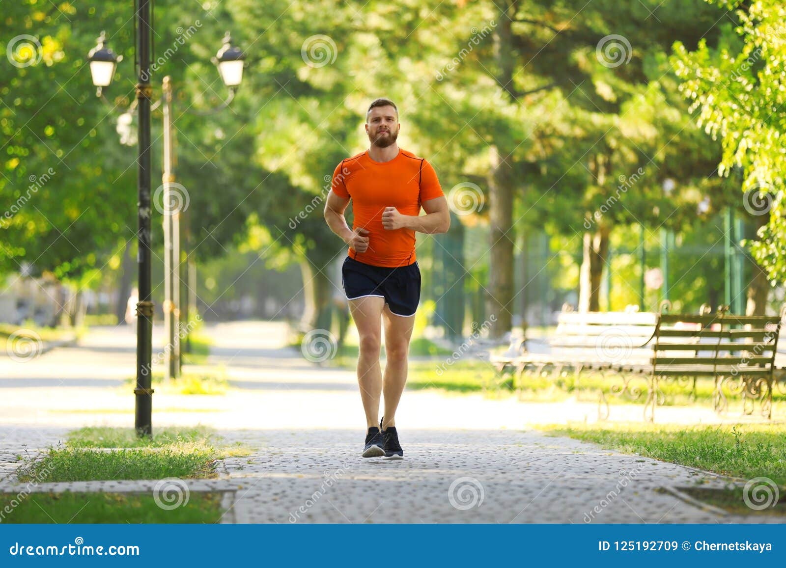 Young man running in park stock image. Image of recreation - 125192709