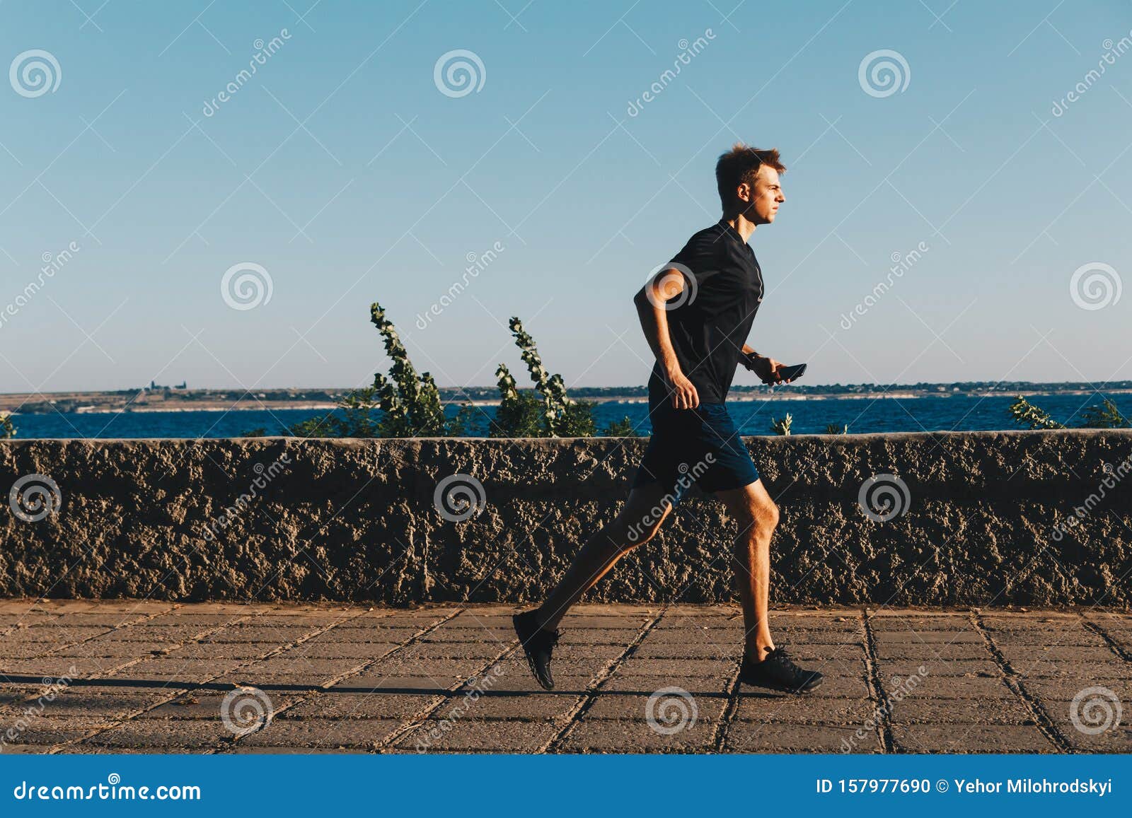Young Man is Running in a Park Stock Photo - Image of healthy, adult ...