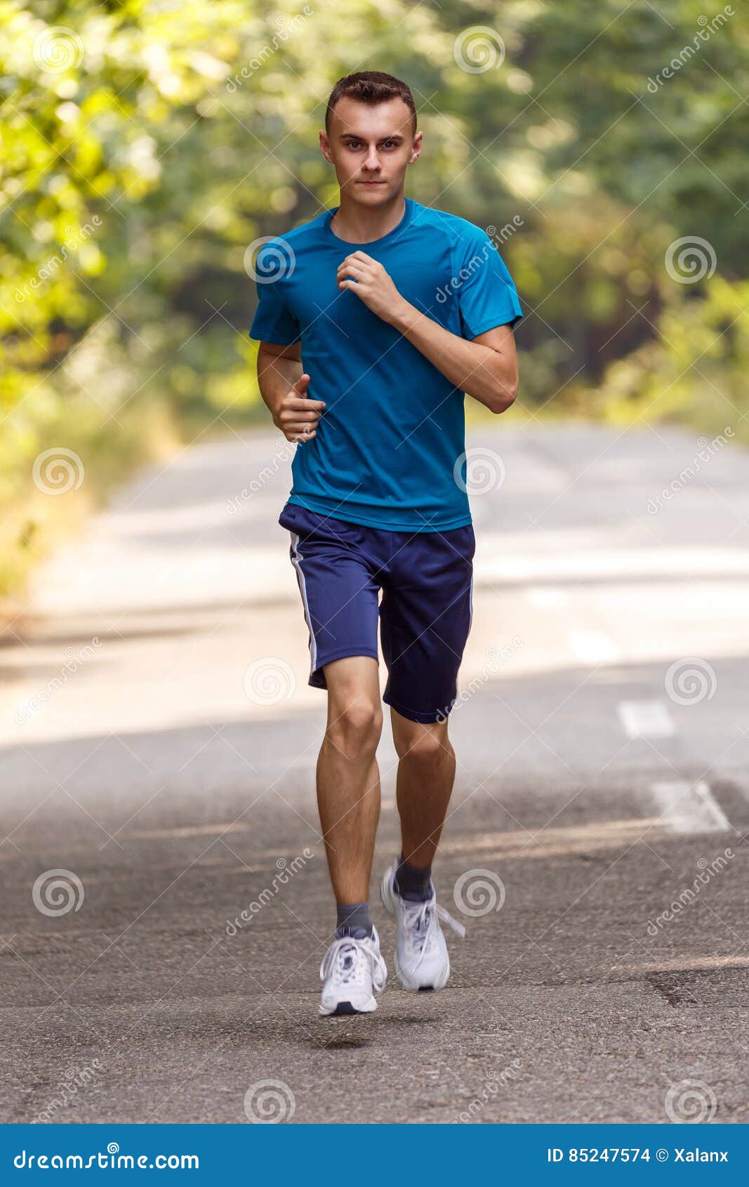 Boy jogging through forest stock photo. Image of fast - 85247574