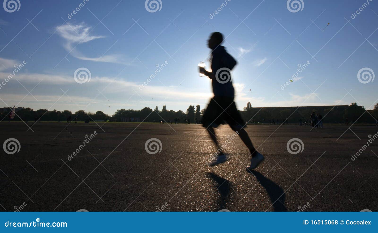Young Man Running on a Runway at Sunset Stock Photo - Image of athlete ...
