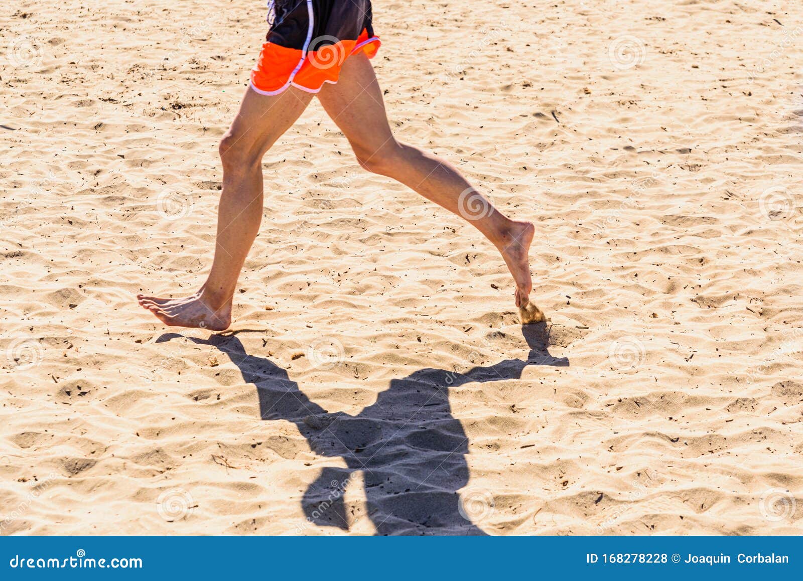 Young Man Running through the Sand of a Beach Stock Photo - Image of ...