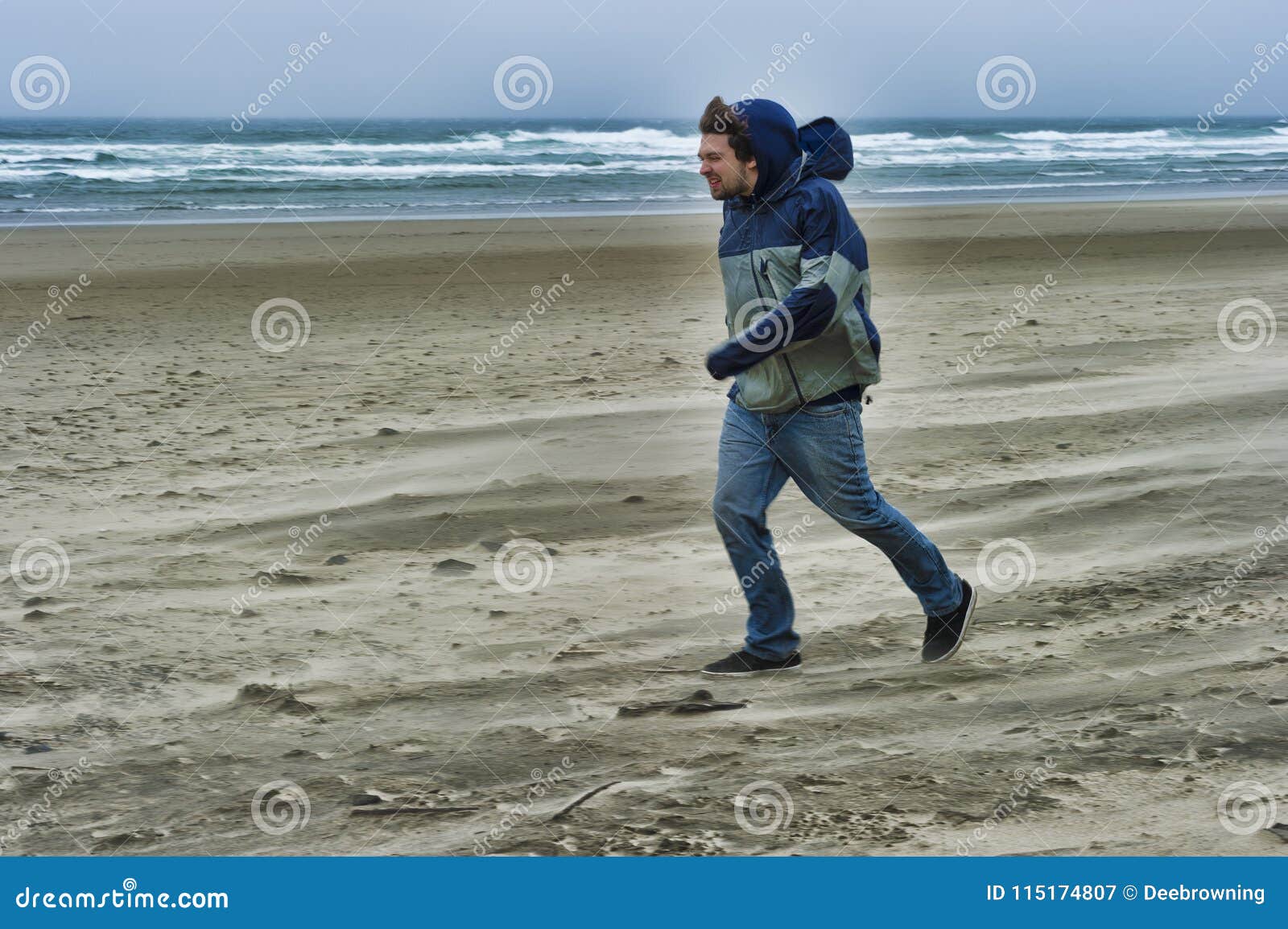 Young Man Runs Against the Wind on Oregon Beach Stock Image - Image of ...