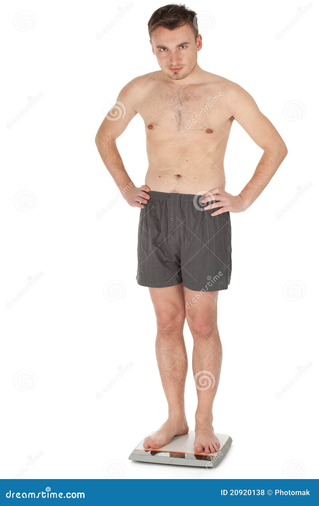 Young man on scale stock photo. Image of size, young - 20920138