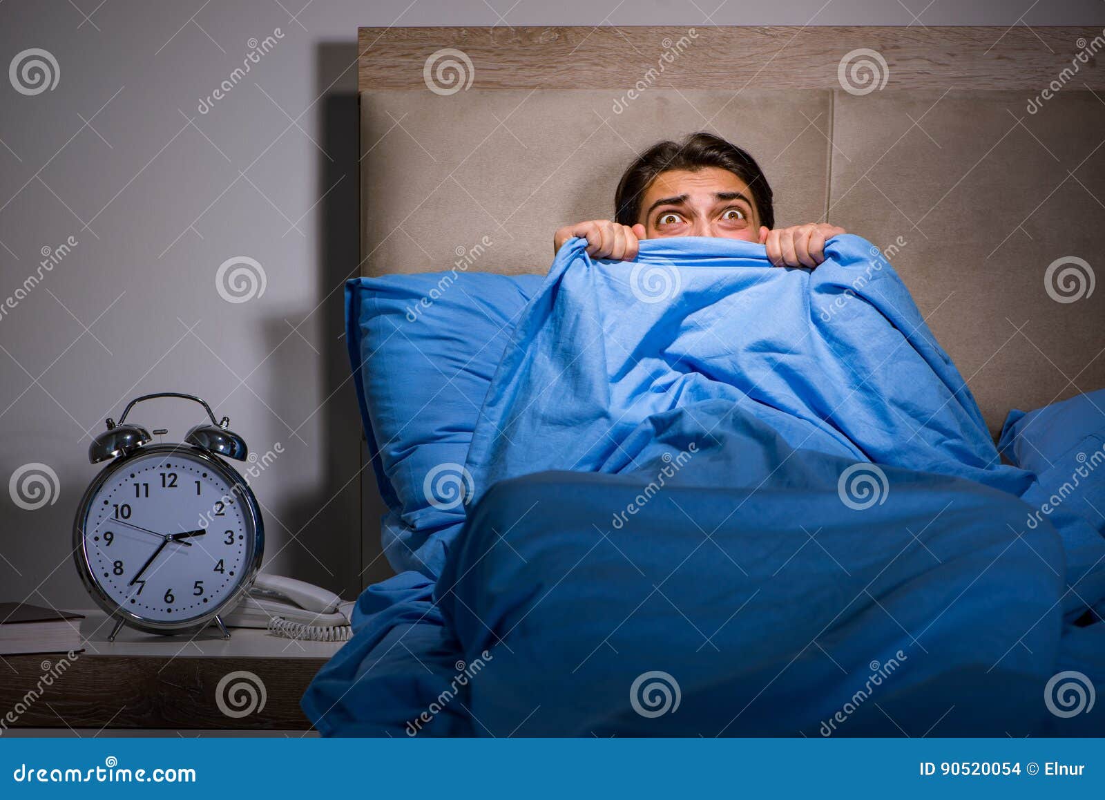 The Young Man Scared in Bed Stock Photo - Image of insomnia, bedroom ...