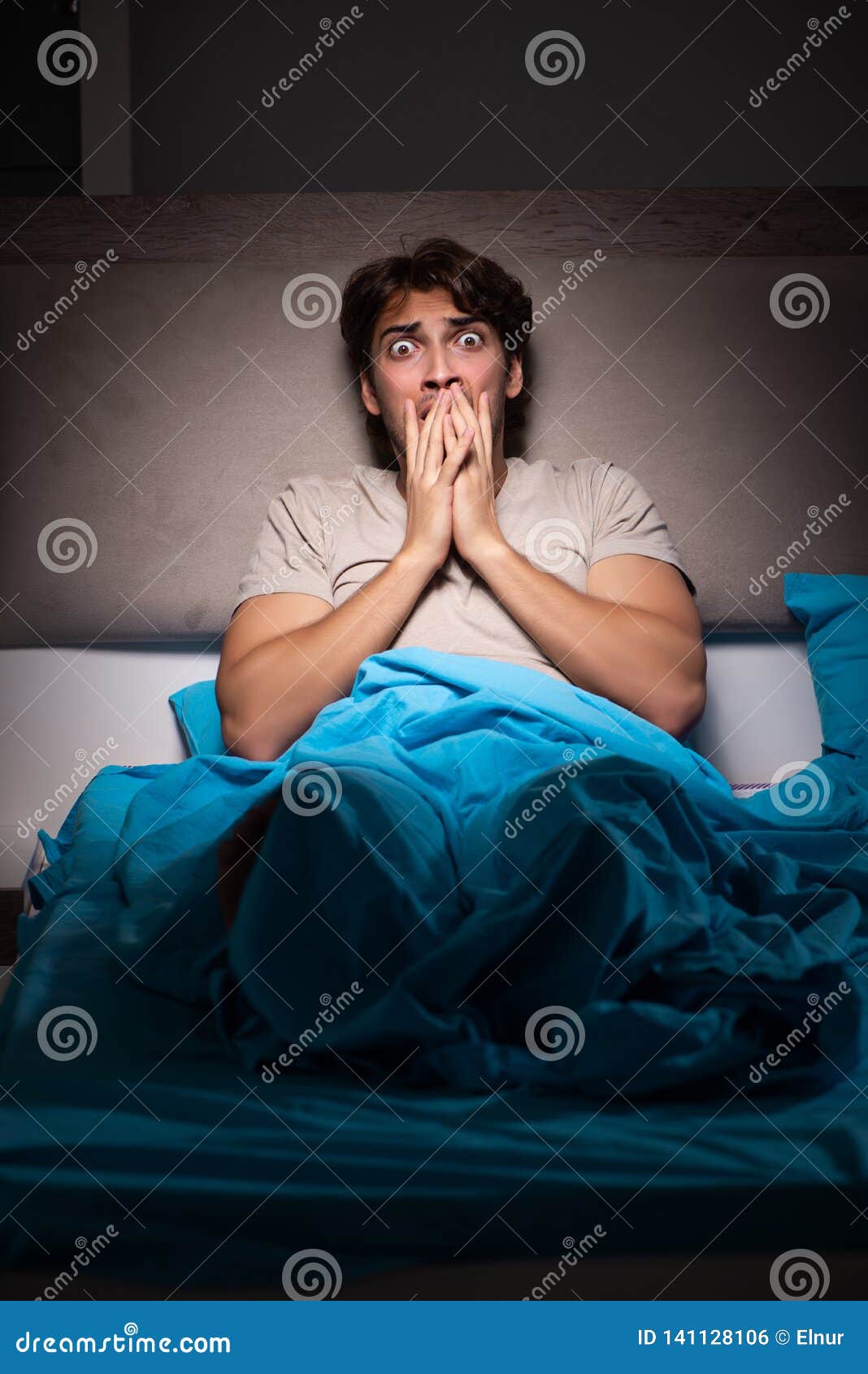 The Young Man Scared in His Bed Having Nightmares Stock Photo - Image ...