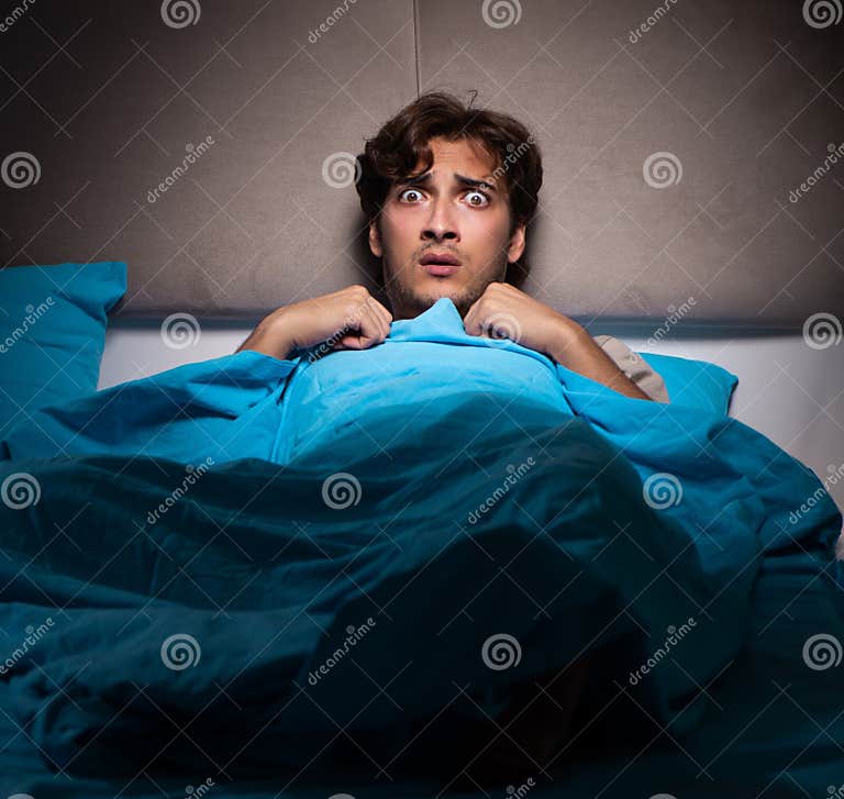 Young Man Scared in His Bed Having Nightmares Stock Image - Image of ...