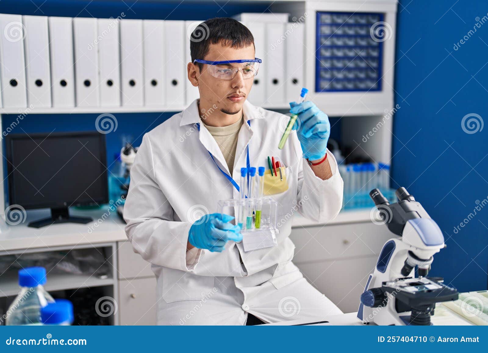 Young Man Scientist Holding Test Tubes at Laboratory Stock Photo ...