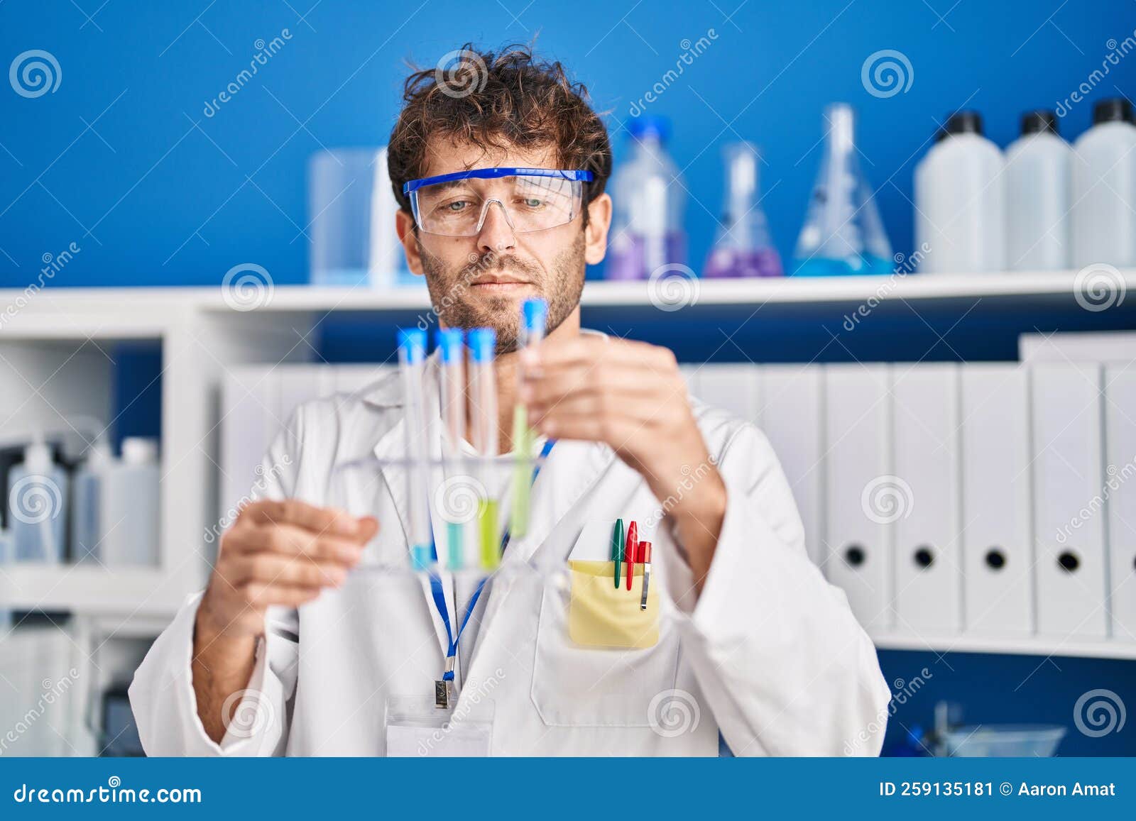 Young Man Scientist Holding Test Tubes at Laboratory Stock Image ... Young Man Scientist Holding Test Tubes at Laboratory Stock Image ...