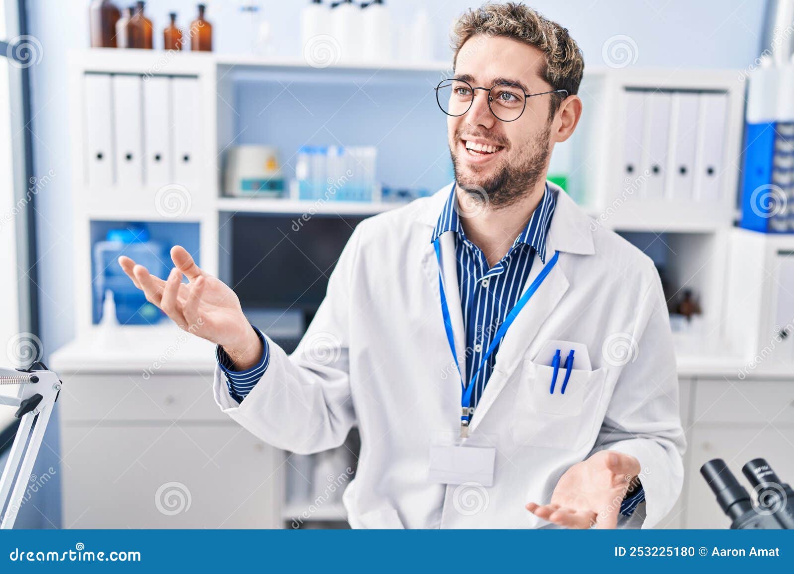 Young Man Scientist Smiling Confident Speaking at Laboratory Stock ...