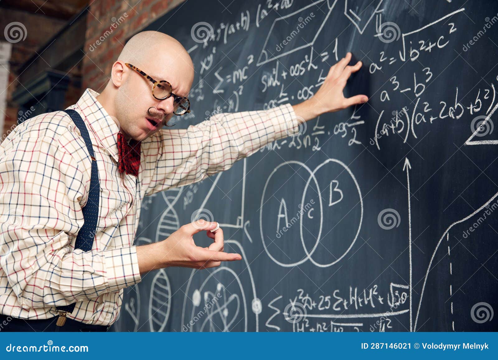 Young Man, Scientist Standing at Blackboard with Formulas and ...