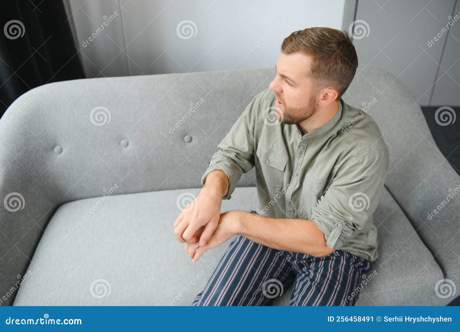 Young Man Scratching Hand Indoors, Space for Text. Allergies Symptoms ...