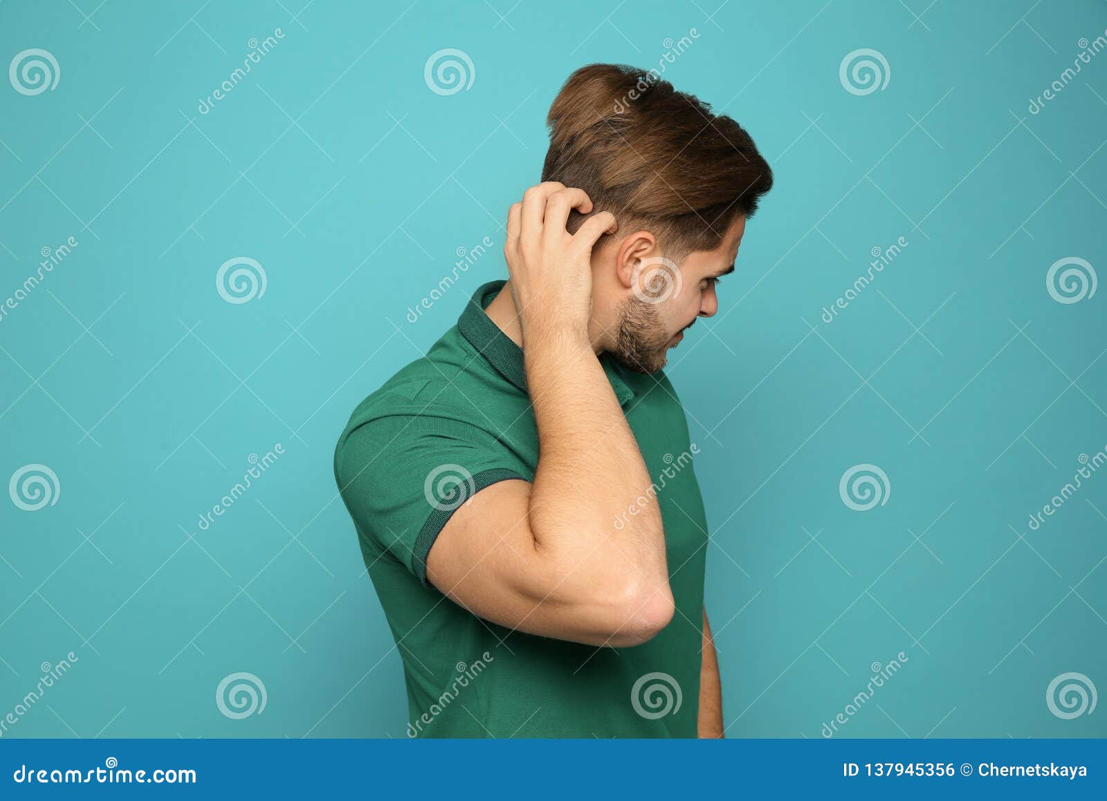 Young Man Scratching Head on Color Background Stock Photo - Image of ...