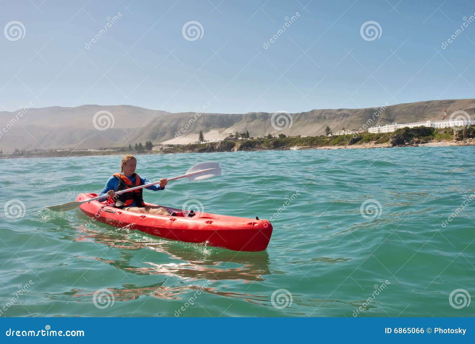 Young man in sea kayak stock photo. Image of beauty, blue - 6865066