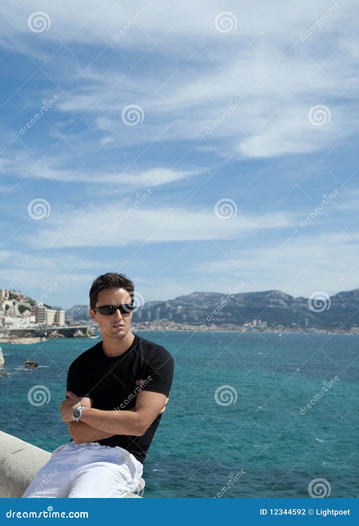 Young man by the sea/ocean stock photo. Image of outdoors - 12344592