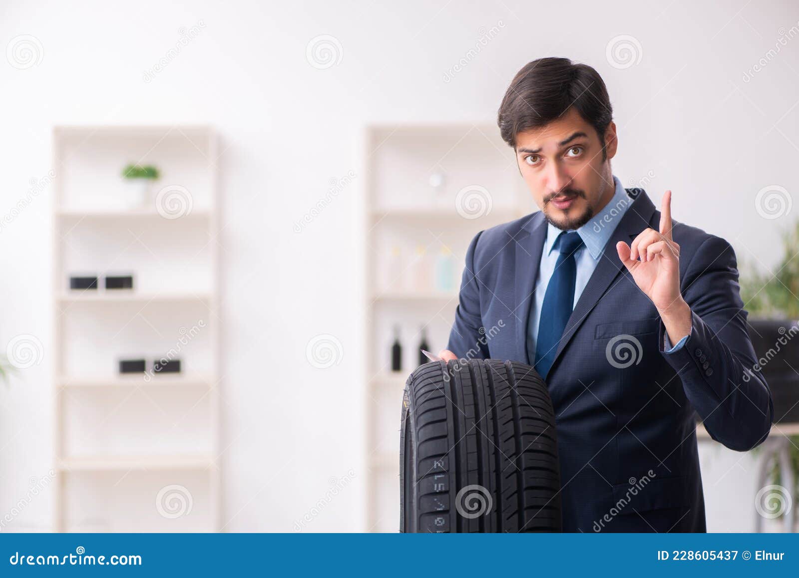 Young Man Selling Tires in the Office Stock Image - Image of manager ...
