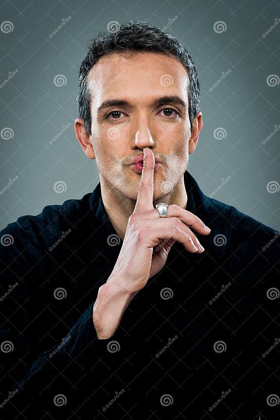 Young Man with Serious Expression Doing a Silent Sign Stock Photo ...