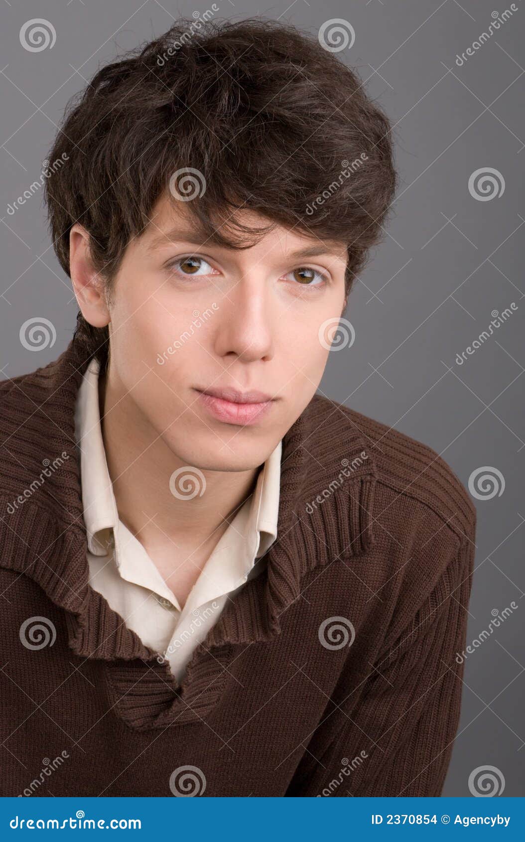 Young man serious looking stock photo. Image of eyes, cardigan - 2370854
