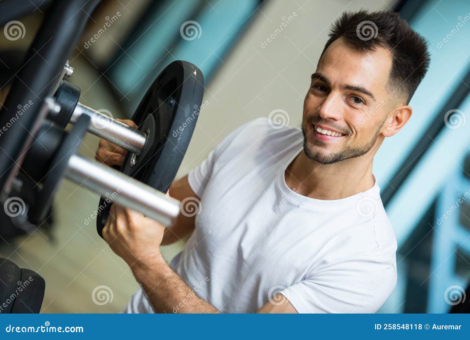 Young Man Setting Up Weights Machine Stock Photo - Image of iron ...