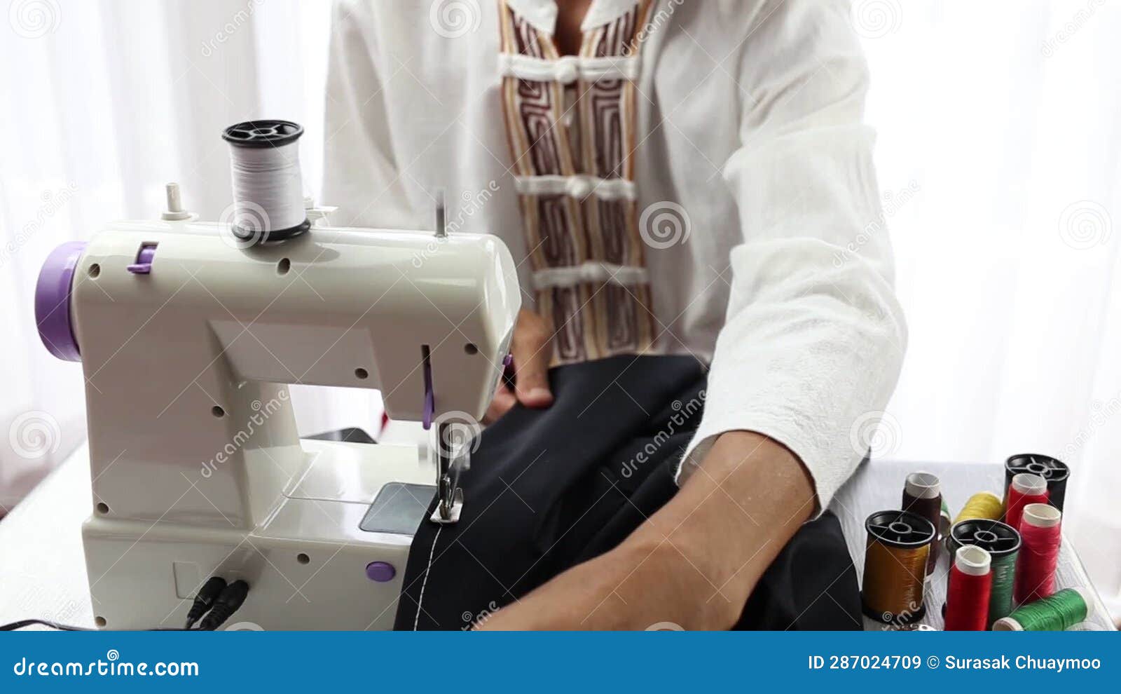 Young Man Sewing with Mini Sewing Machine at Home Stock Video - Video ...