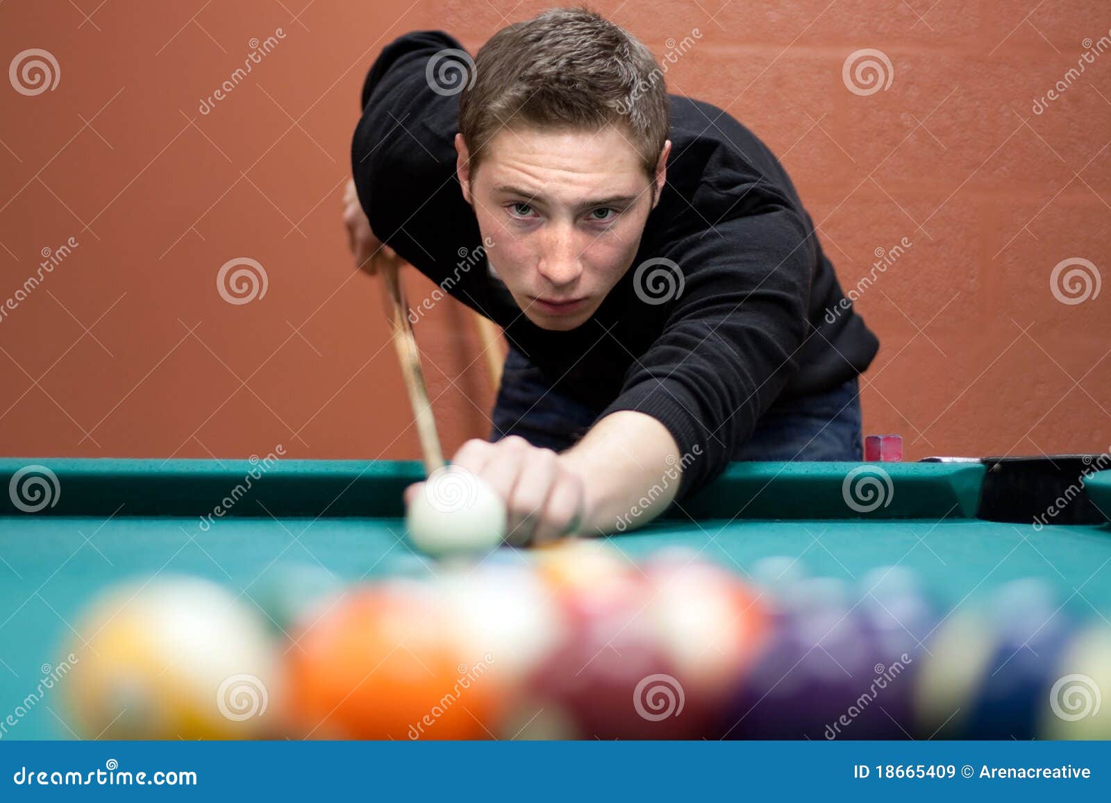 Young Man Shooting Pool stock image. Image of playing - 18665409