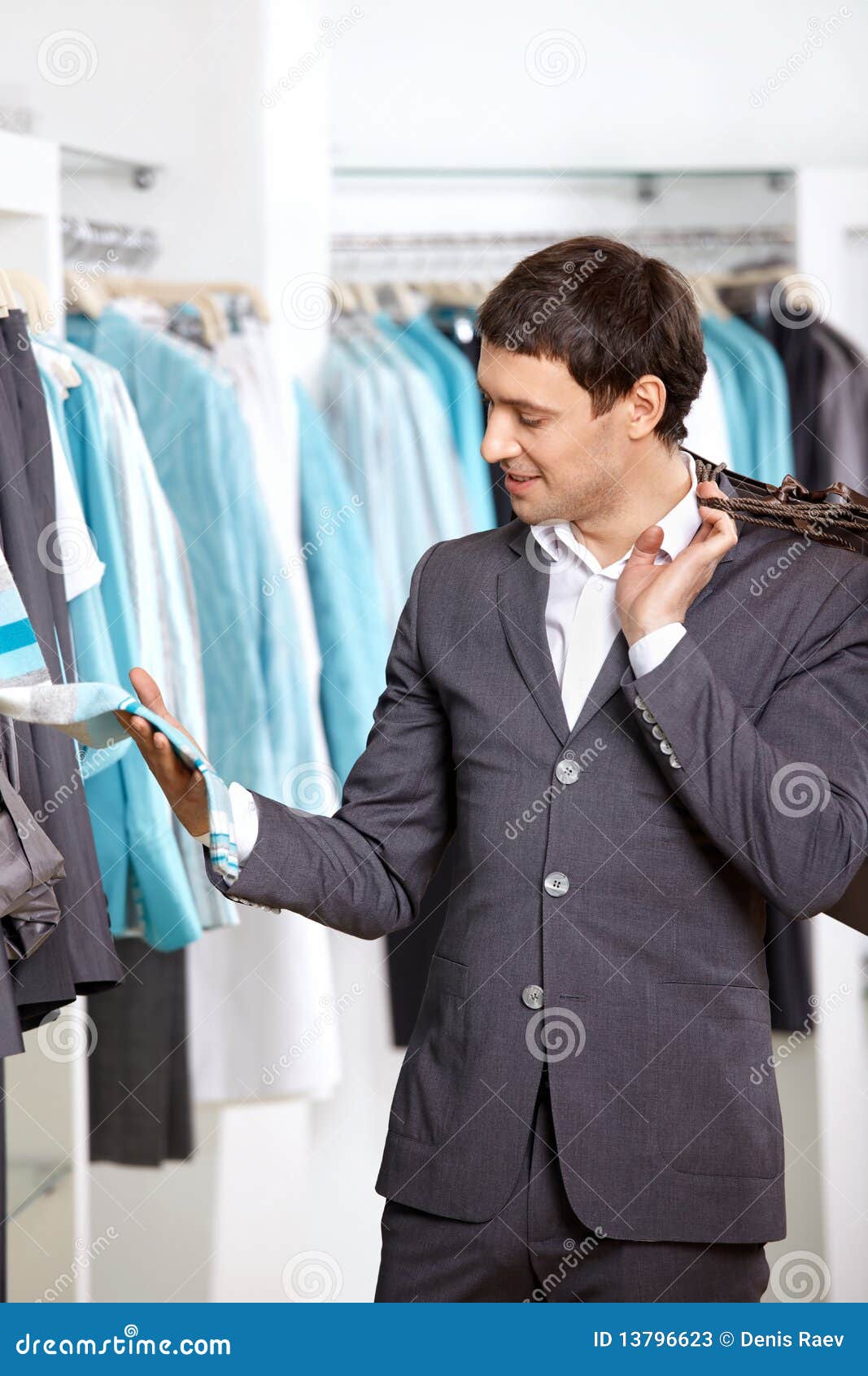 The young man in shop stock image. Image of beauty, buying - 13796623